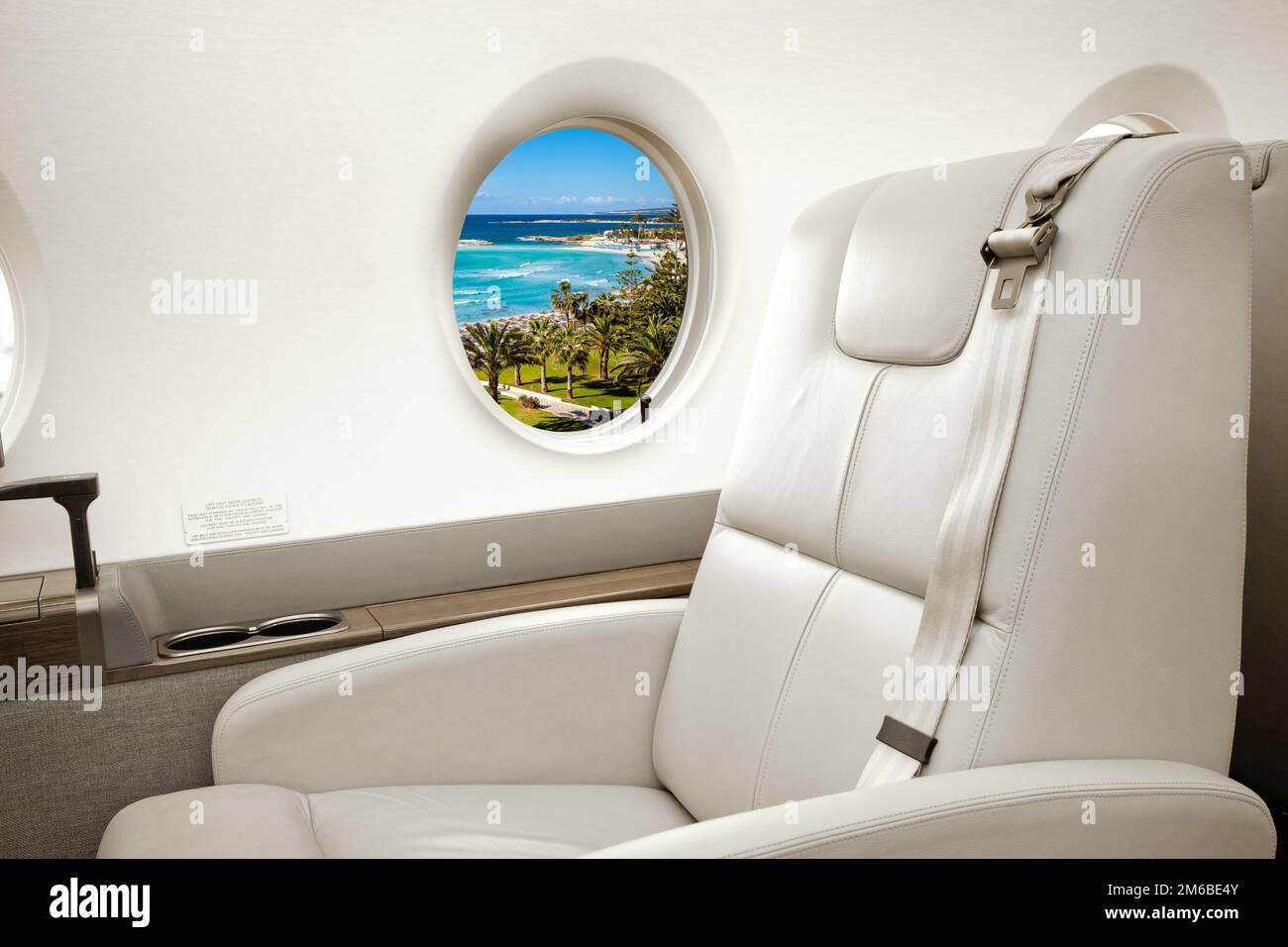 Sea and beach view in aircraft window, business jet flight Stock Photo ...