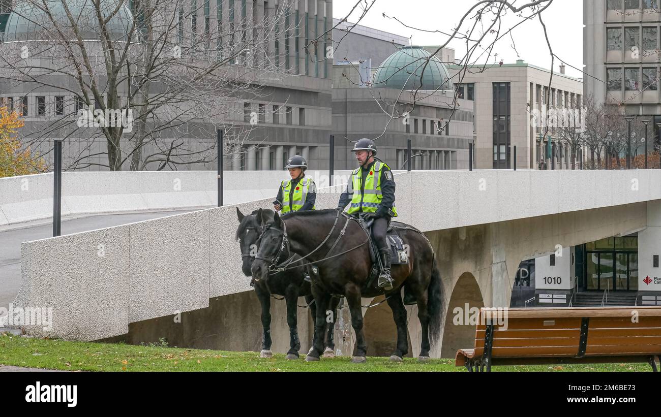 Two mounted Montreal police in Montreal city Stock Photo - Alamy