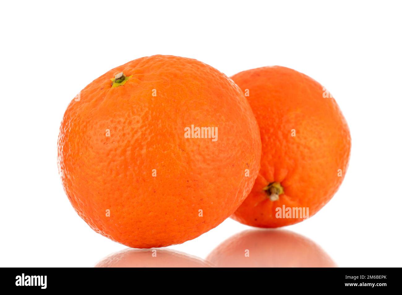 Two sweet organic tangerines, macro, isolated on white background Stock ...