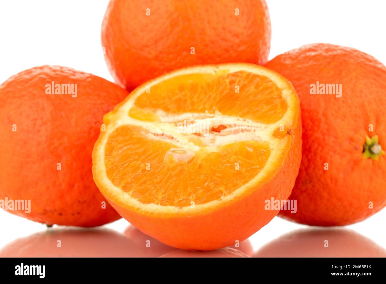 One half and three whole sweet organic tangerines, macro, isolated on ...