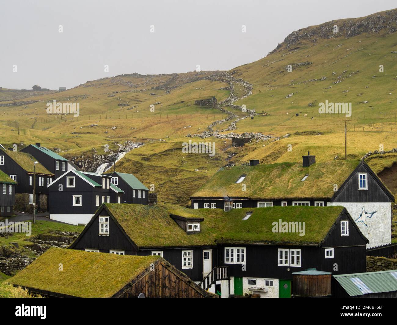 Black and white houses with turf roof of Mykines Stock Photo - Alamy