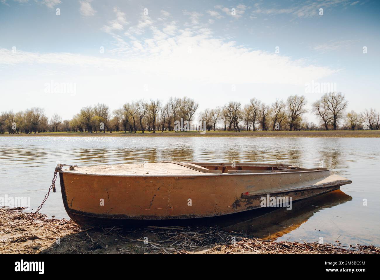 Boat at the riverside Stock Photo - Alamy
