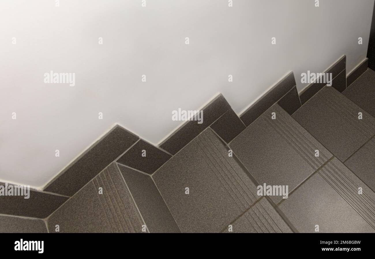 Concrete staircase lined with tiles Stock Photo - Alamy
