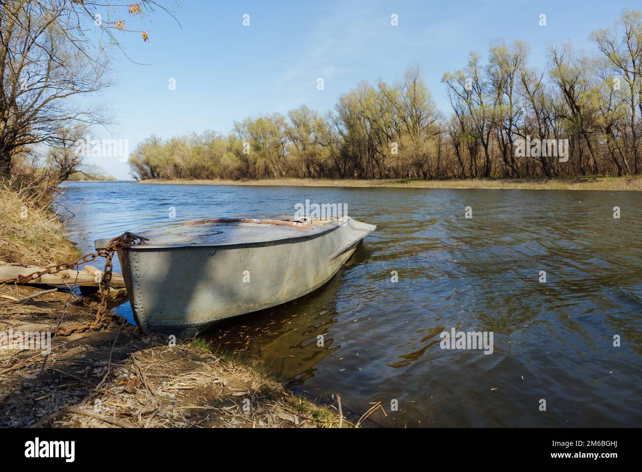 Boat at the riverside Stock Photo - Alamy