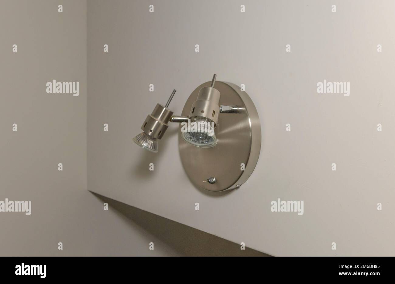 Simple wall lamp with two spots Stock Photo - Alamy