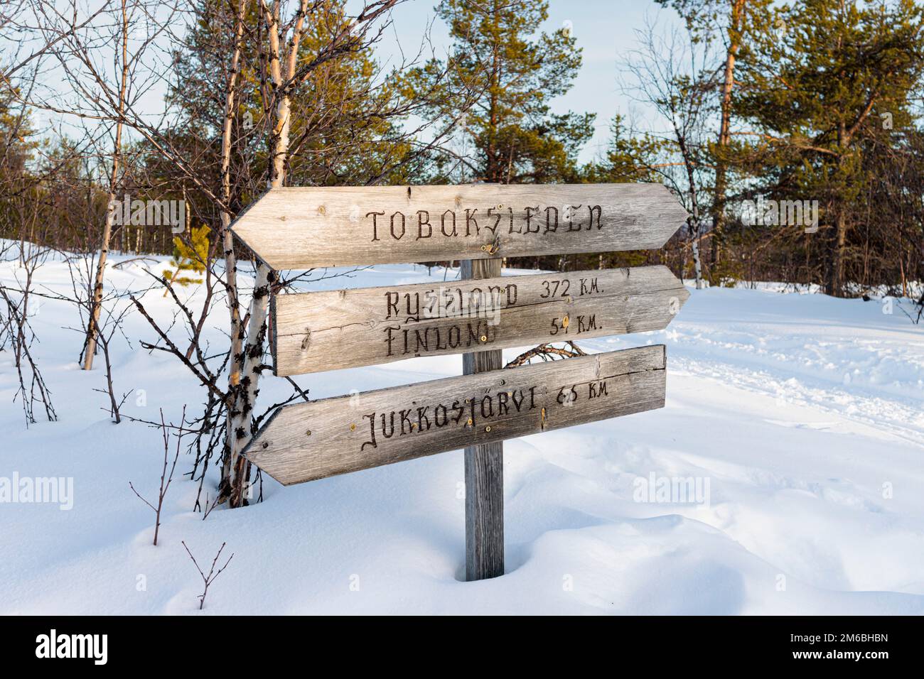 Signs in the snow in Swedish Lapland Stock Photo - Alamy