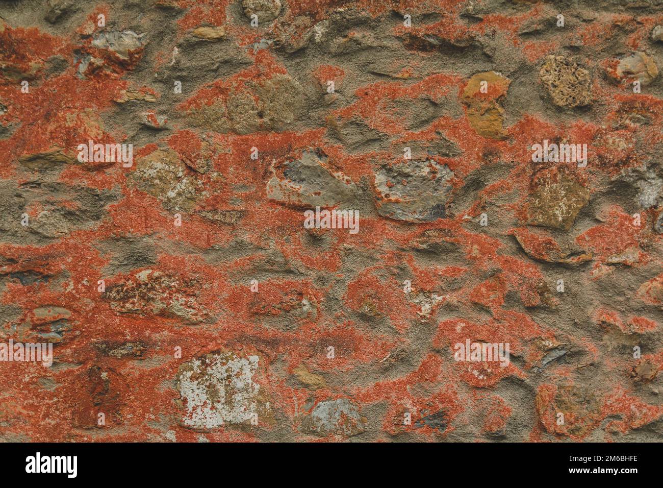 Horizontal stoned rock cobble stone wall red mortar for a textured ...