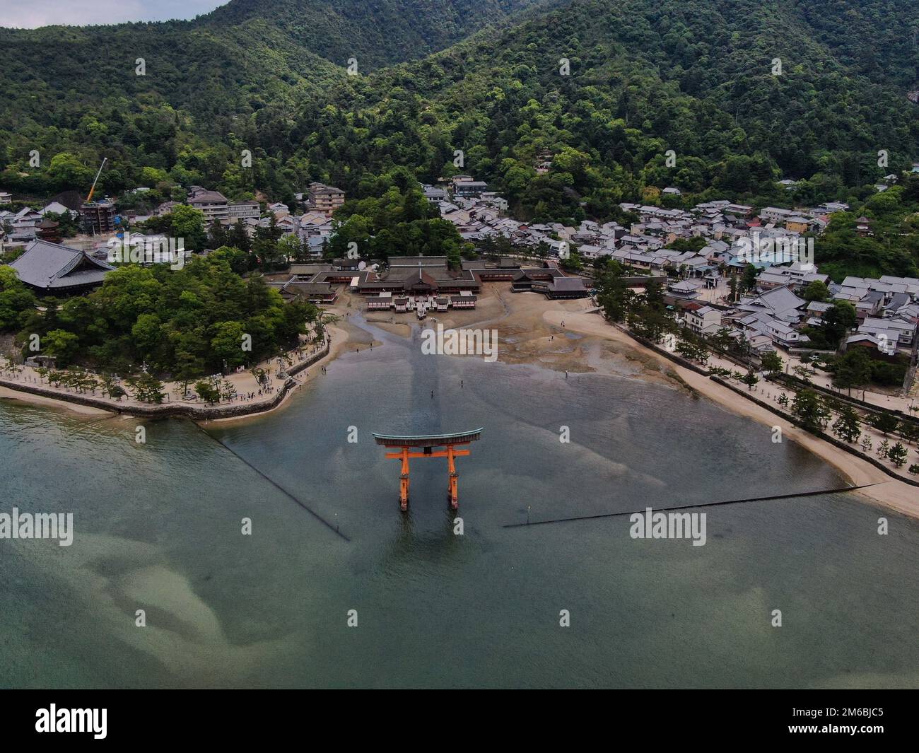 An aerial shot of the Itsukushima Shrine or the Floating Torii Gate on ...