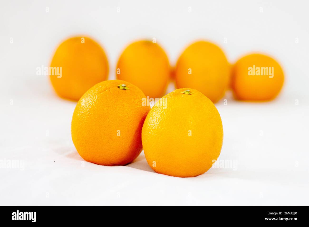 group of oranges on white background Stock Photo - Alamy