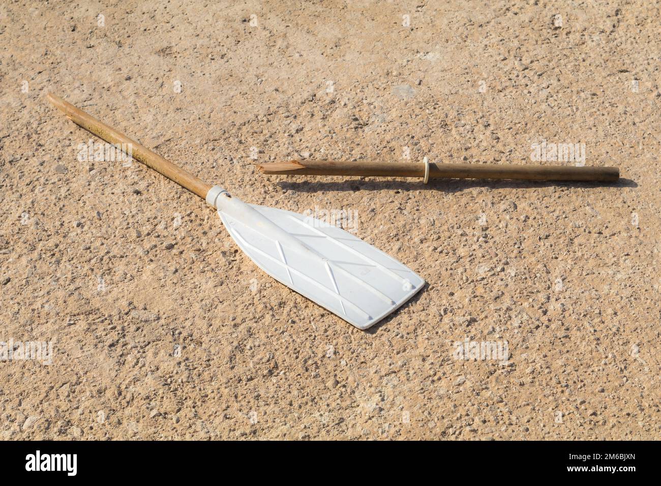 Wooden broken oar, on tan concrete, in the sun Stock Photo - Alamy