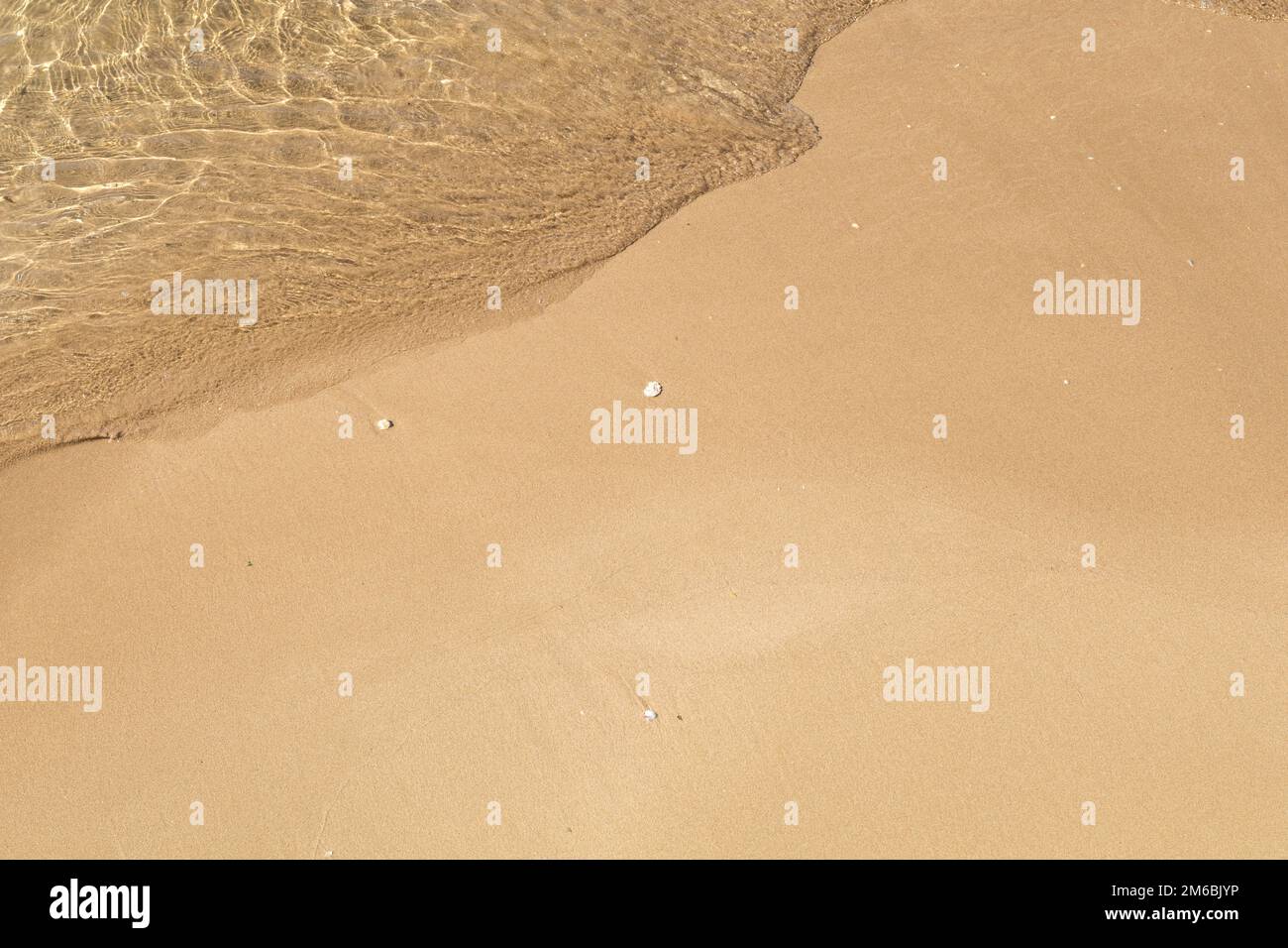 Beautiful crystal clear sea water, Gentle waves breaking on golden sand ...