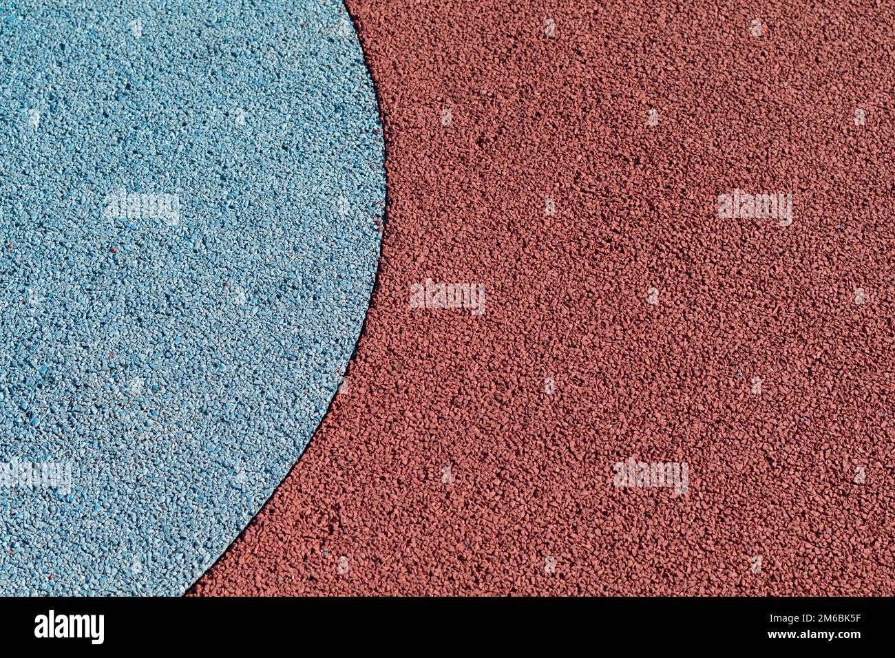 Colorful red and blue Rubber Wetpour playground floor surface Stock Photo - Alamy