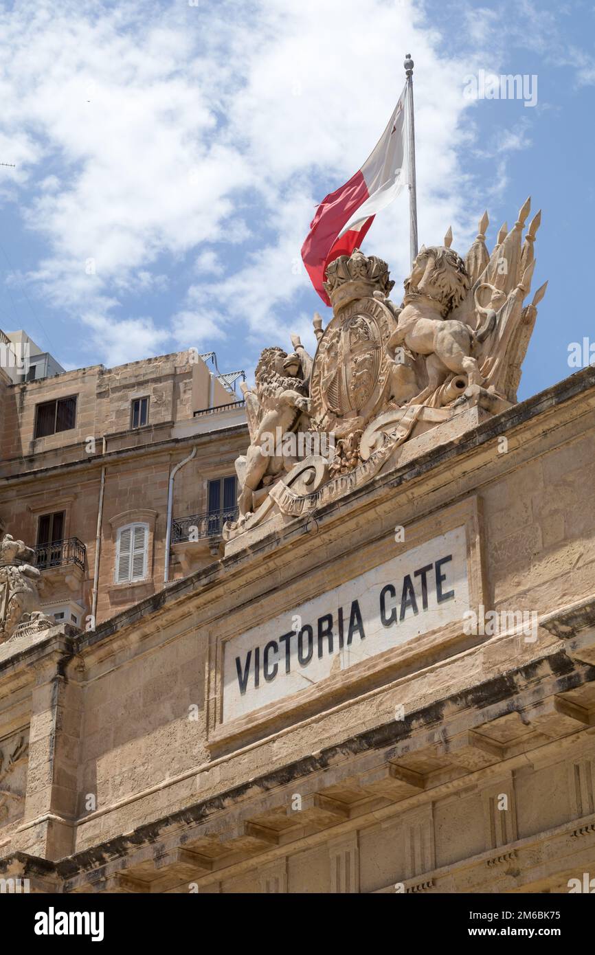 Victoria Gate carvings and Maltese Flag, Valletta, Malta Stock Photo ...