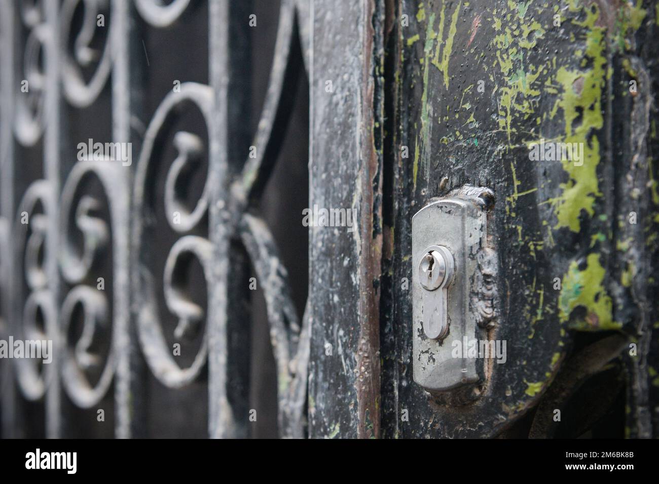 locksmith at the old iron gate Stock Photo - Alamy