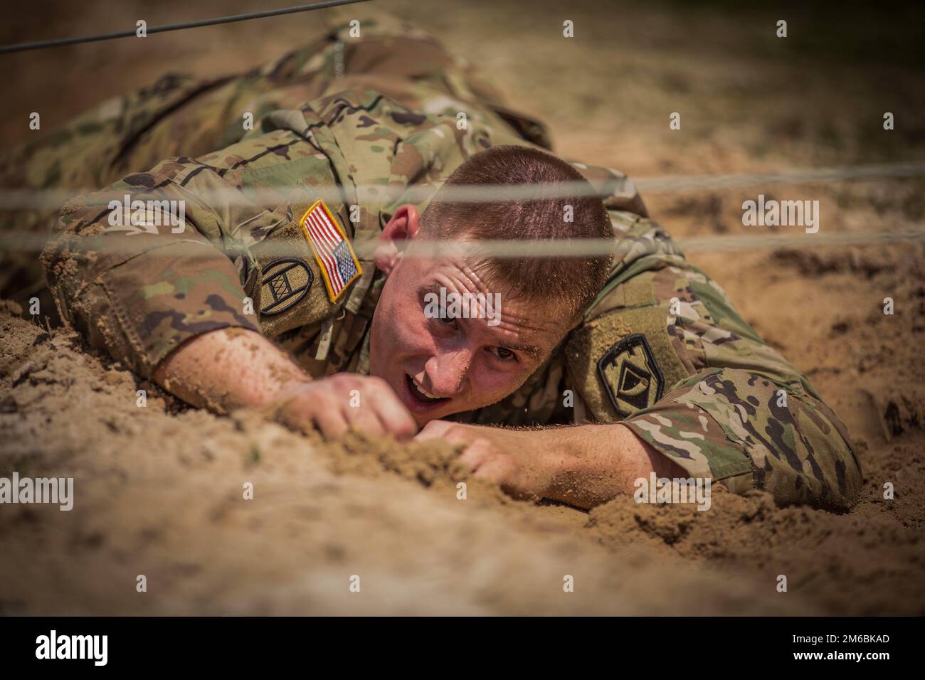 Sgt. Jefferson Gwynn, the winning NCO for the WVNG, low crawls while ...
