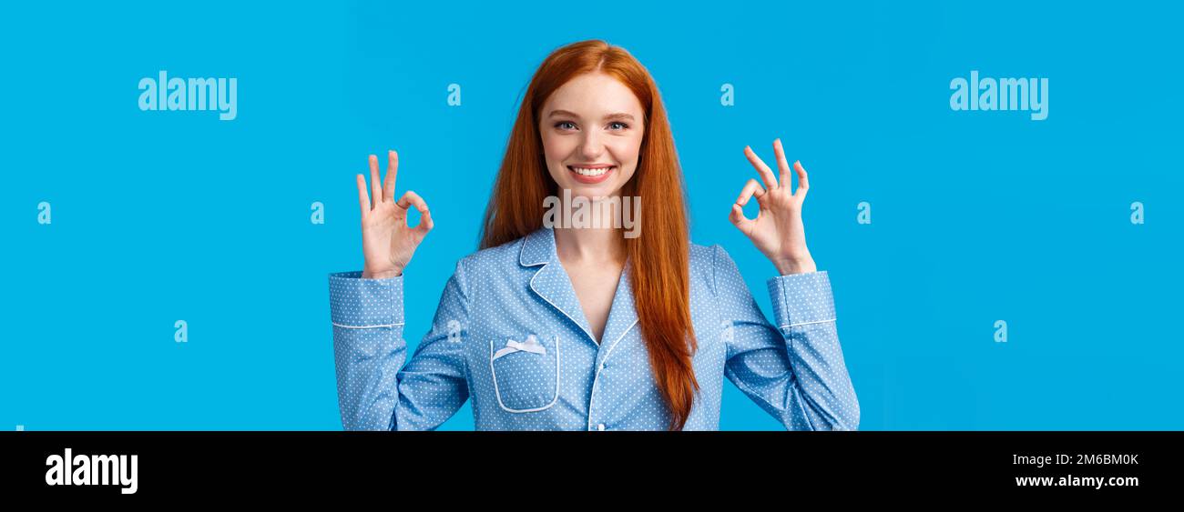 Satisfied good-looking redhead woman saying alright, show okay gesture ...