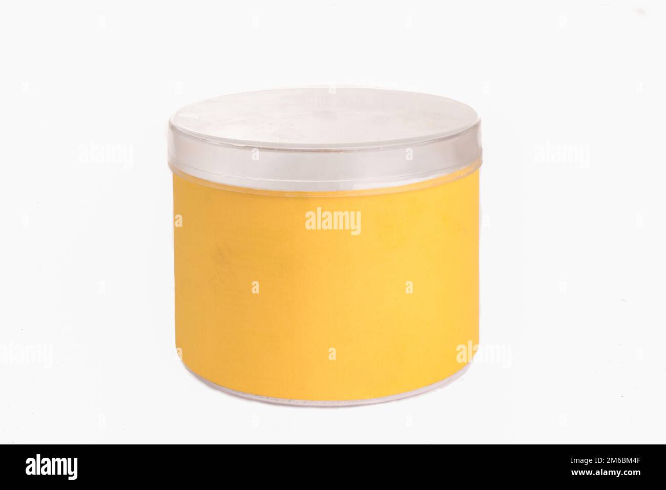 Round yellow plastic container with silver cap Stock Photo - Alamy