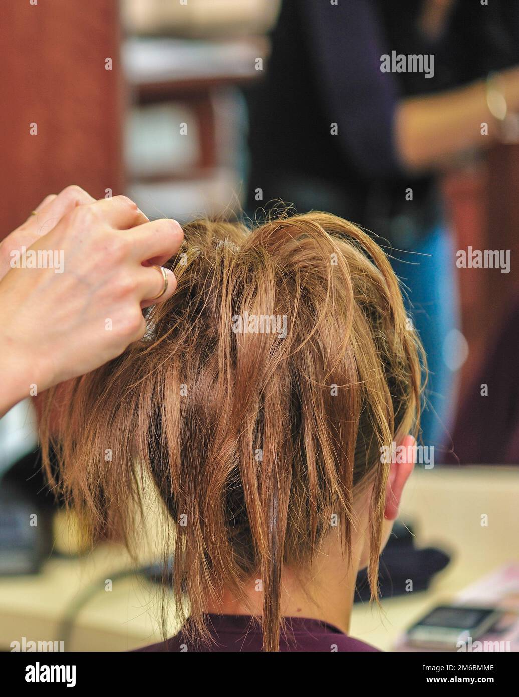 Applying hair gel hi-res stock photography and images - Alamy