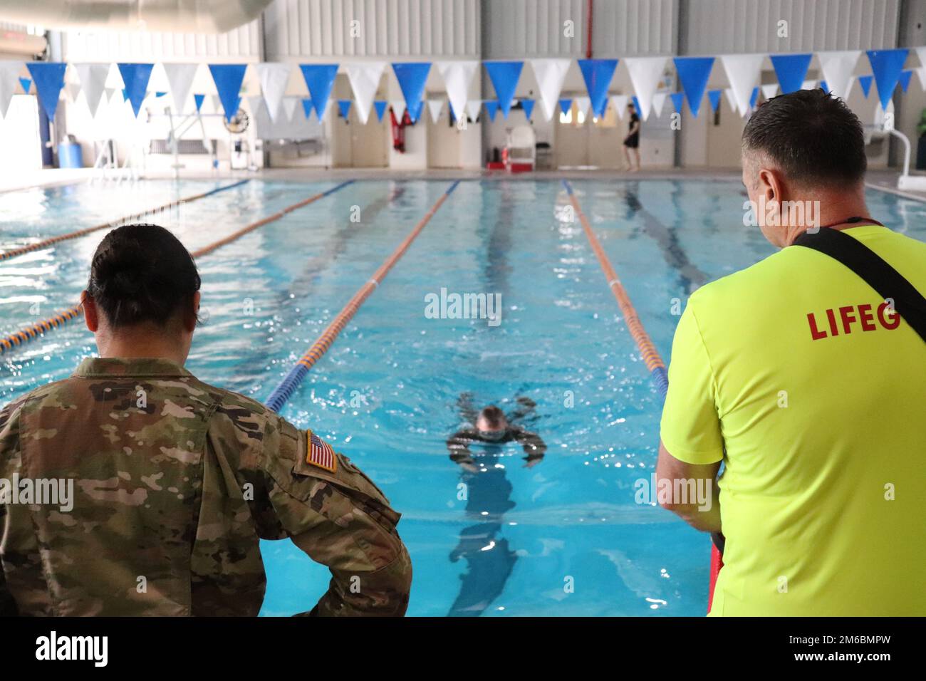 A lifeguard and 1st Lt. Jessica Salas, 394th Field Hospital oversee a ...