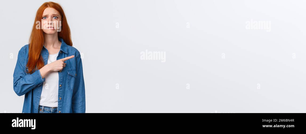 Anxious and worried cute girl having first day new college, biting lip ...