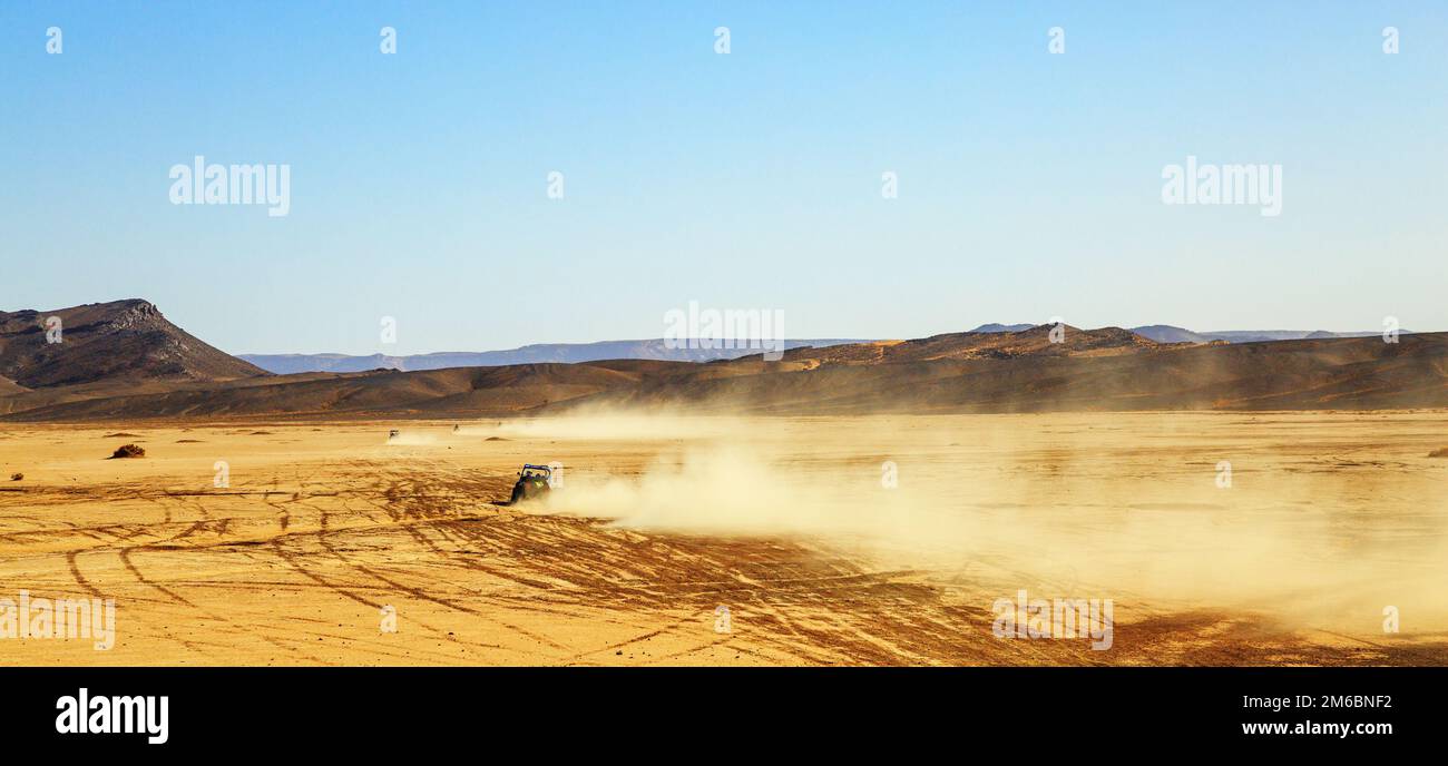 Off road car with it's pilot in Morocco Stock Photo - Alamy