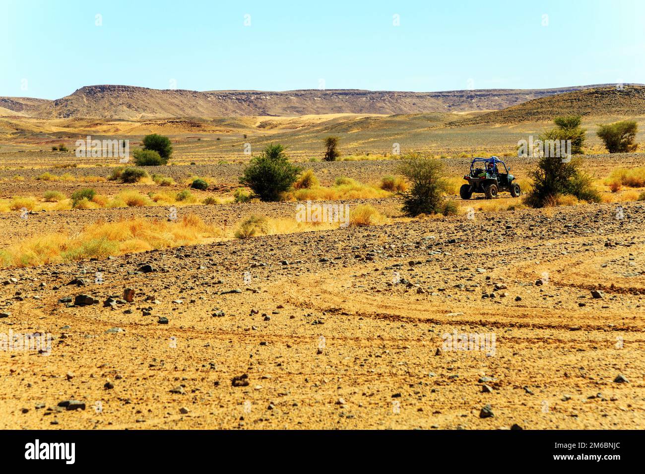 Off road car with it's pilot in Morocco Stock Photo - Alamy