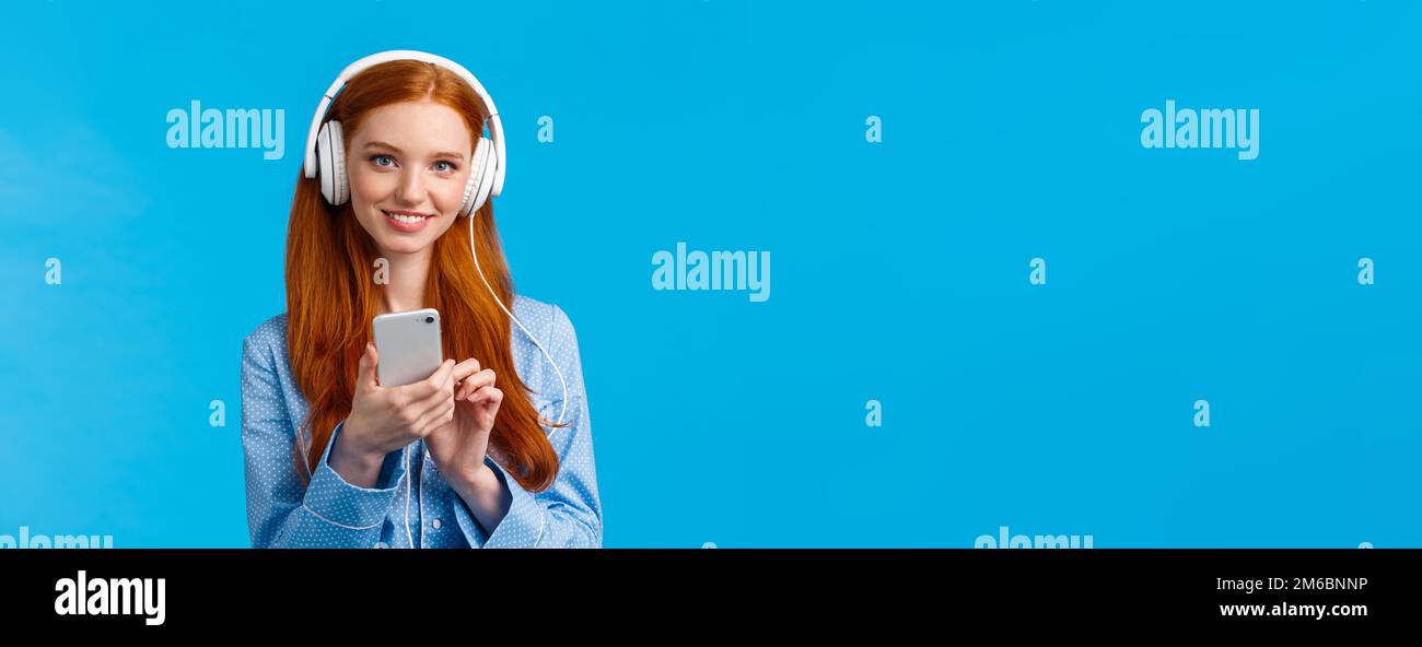 Tender and feminine, cute redhead female student, wearing headphones ...