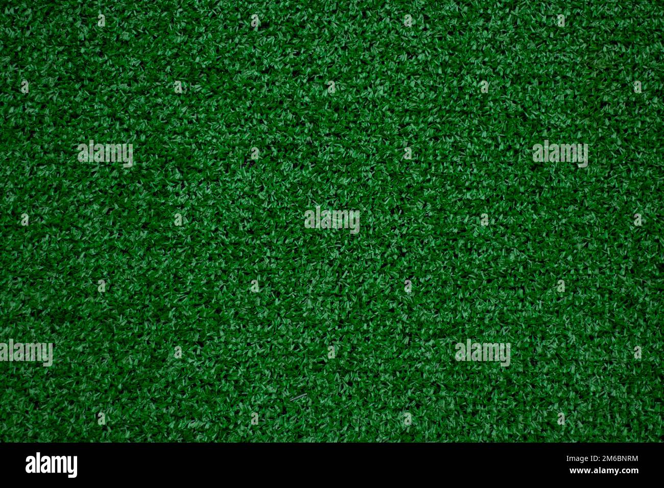 green artificial grass background as background Stock Photo - Alamy