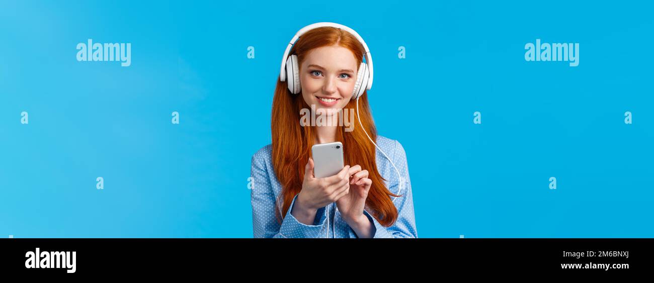 Tender and feminine, cute redhead female student, wearing headphones ...