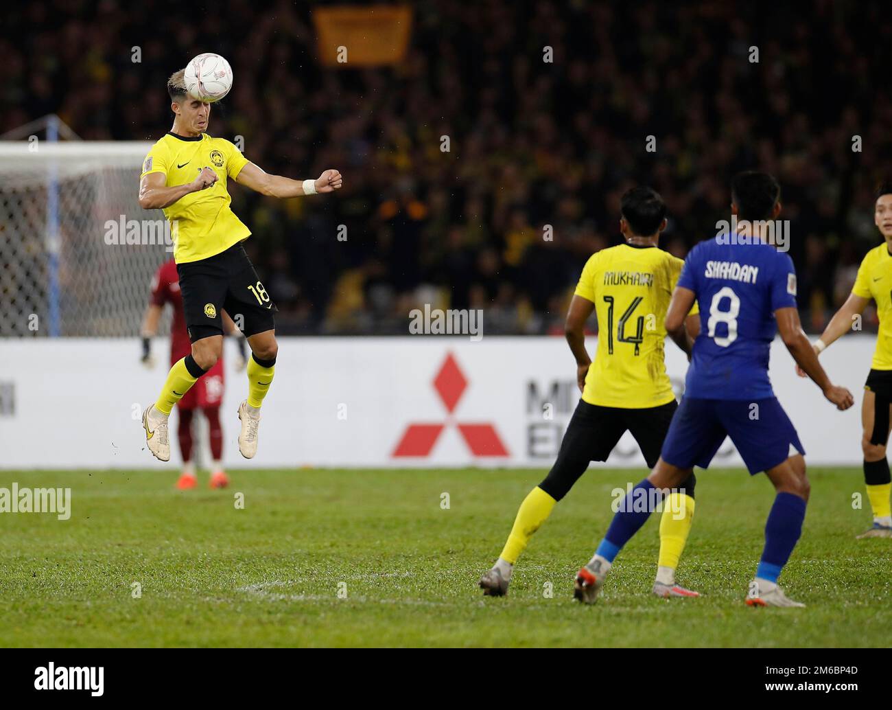 Brendan Seng Ling Gan of Malaysia (L) in action during the AFF ...