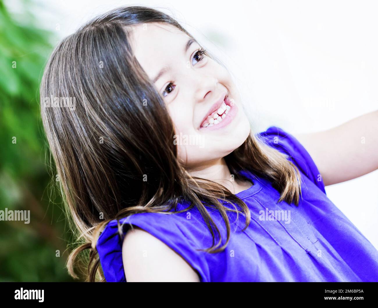 Expressive portrait of very cute girl smiling child Stock Photo - Alamy