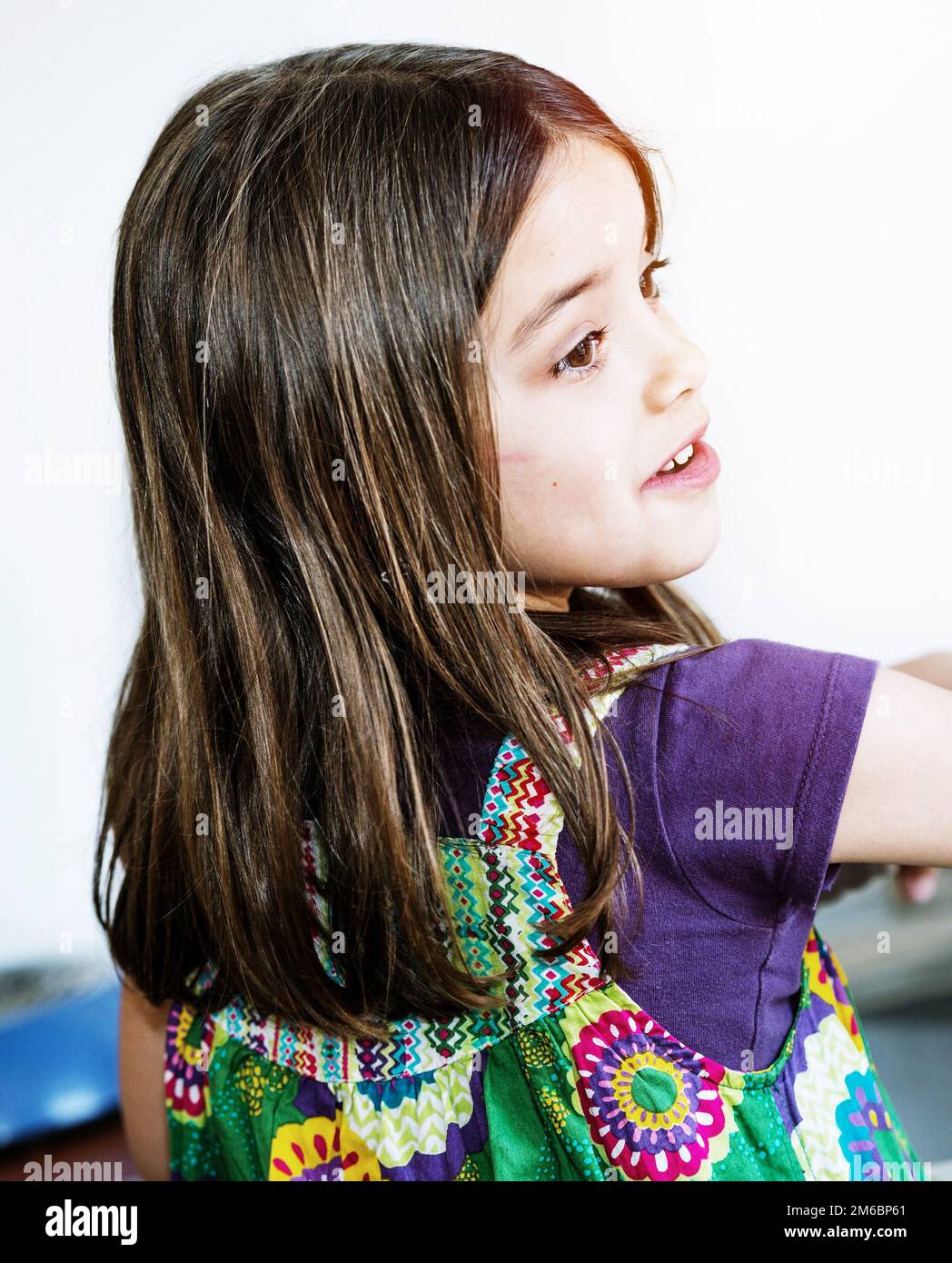 Very cute kid doing crockery Stock Photo - Alamy