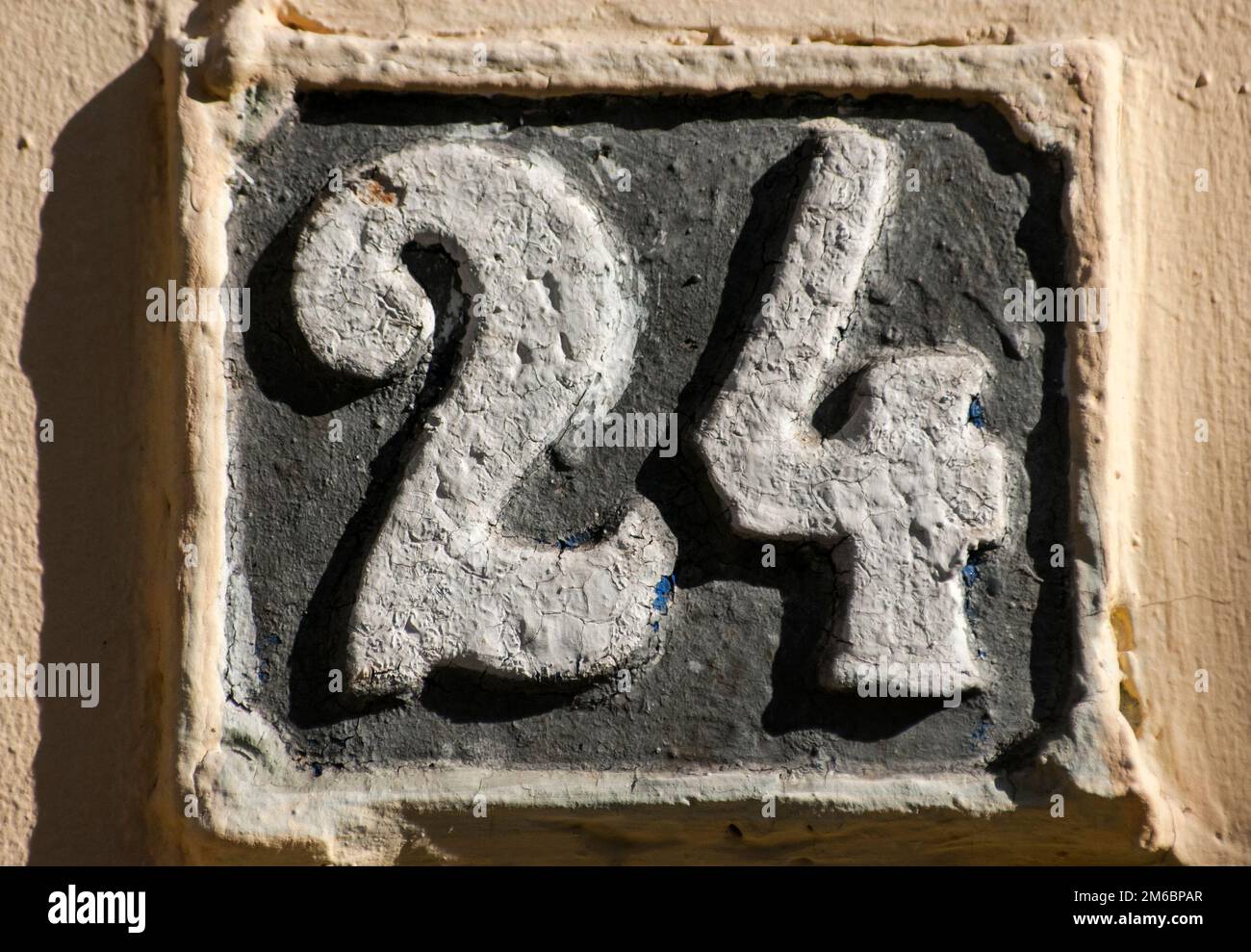 Old retro weathered cast iron plate with number 24 Stock Photo - Alamy