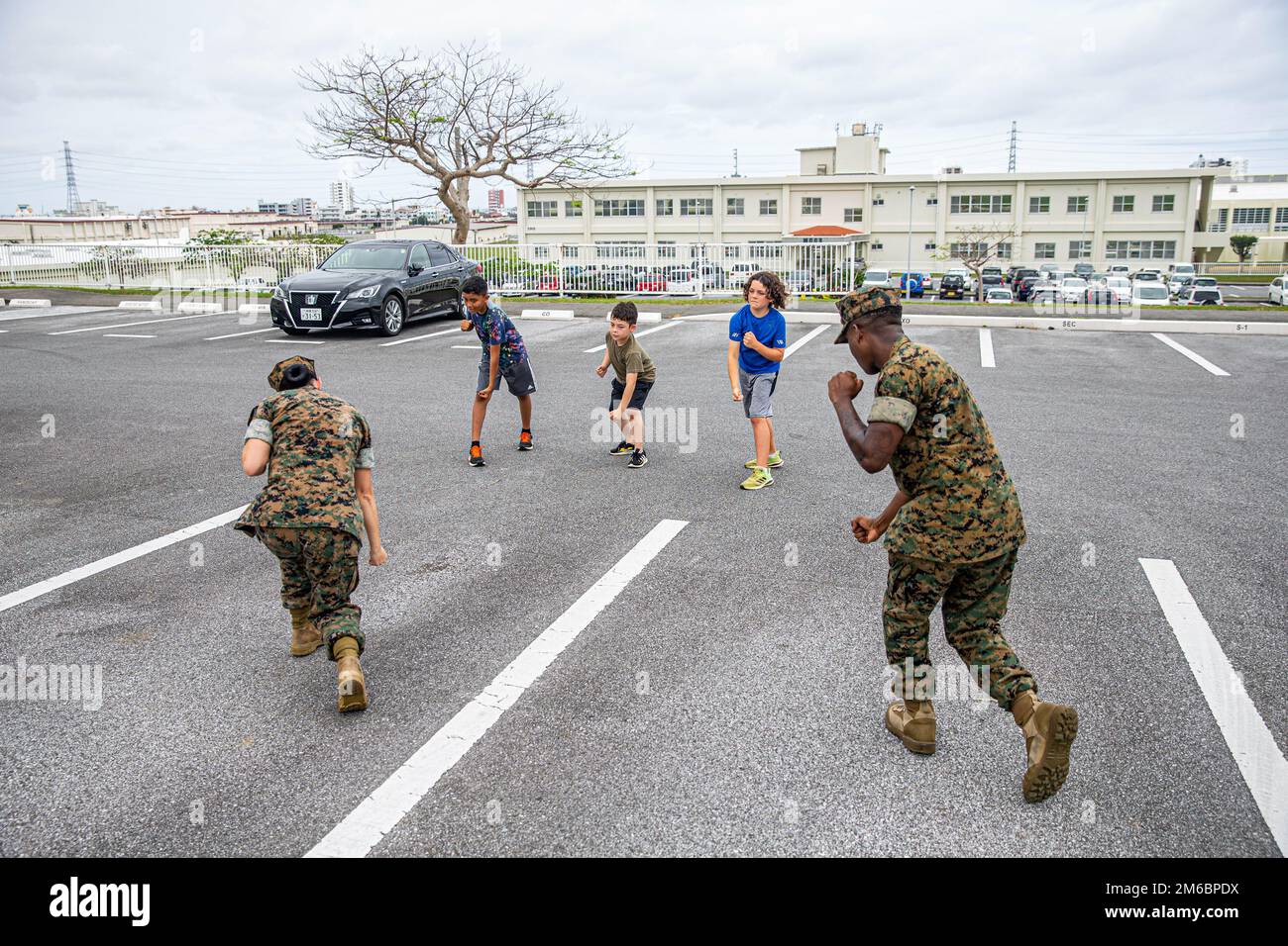 Families of service members learn martial arts techniques during the ...