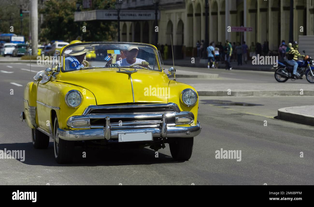 American yellow Cabriolet classic car drives in Havana Cuba - Serie ...