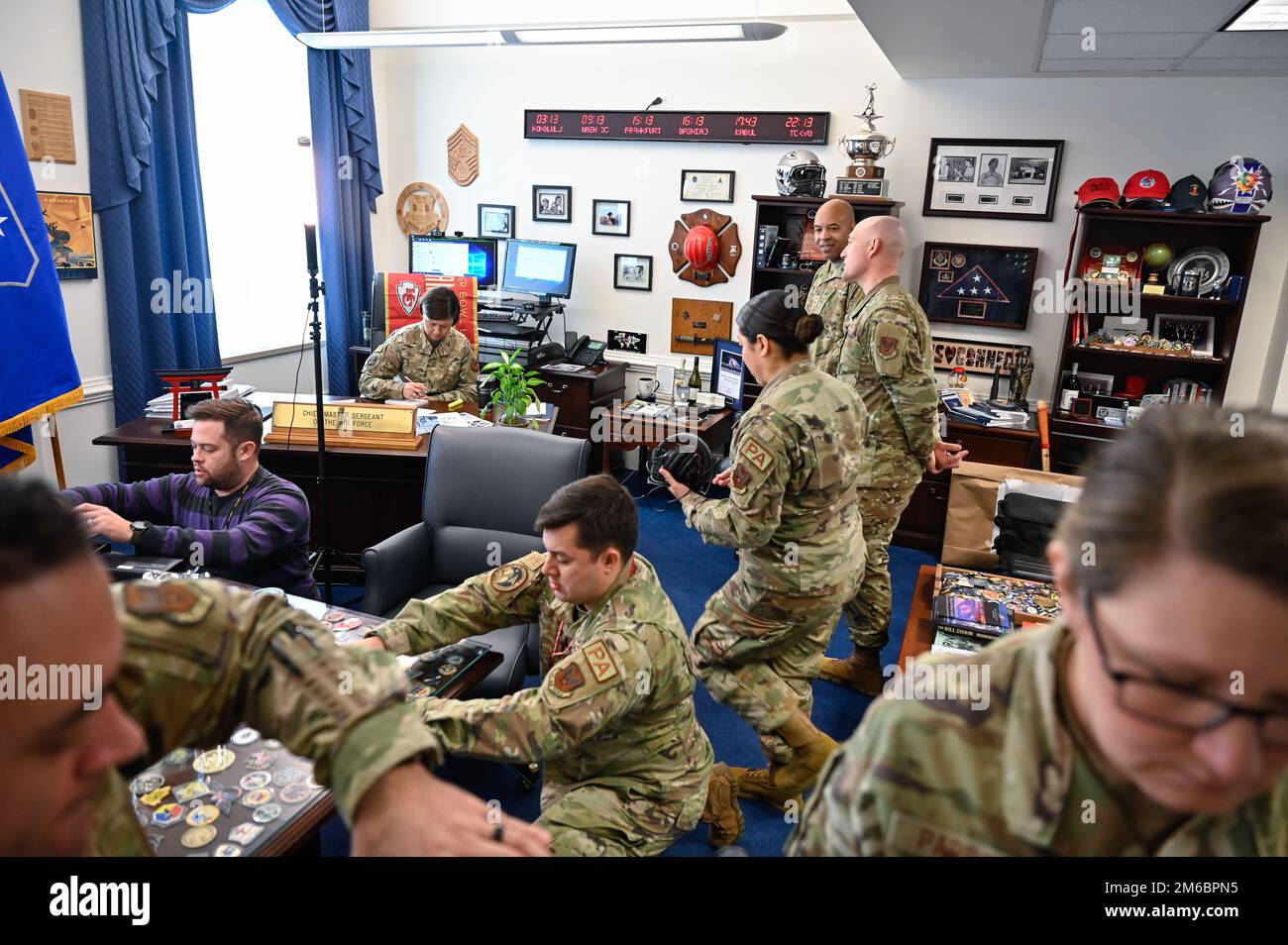 Members of the Air Force television team ready equipment before filming ...