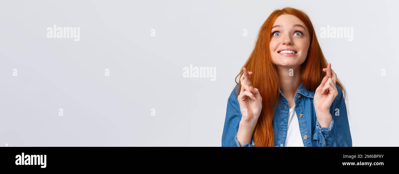 Excited and hopeful, optimistic cute redhead girl want dream come true ...