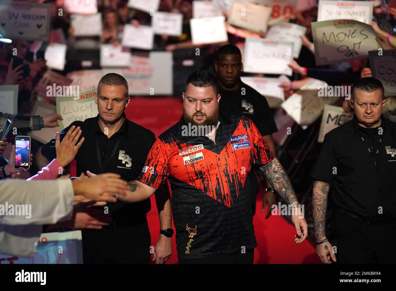 Michael Smith walks through the crowd ahead of the final of the Cazoo ...