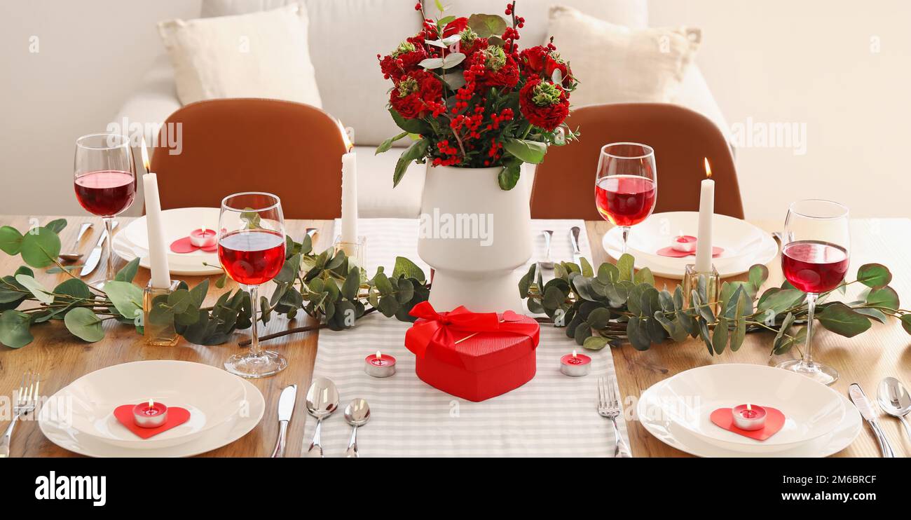 Festive table setting for Valentine's Day dinner with beautiful flowers ...