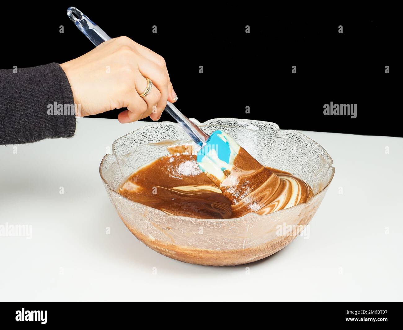 Female person blending chocolate gently with Gogl-Mog Stock Photo - Alamy