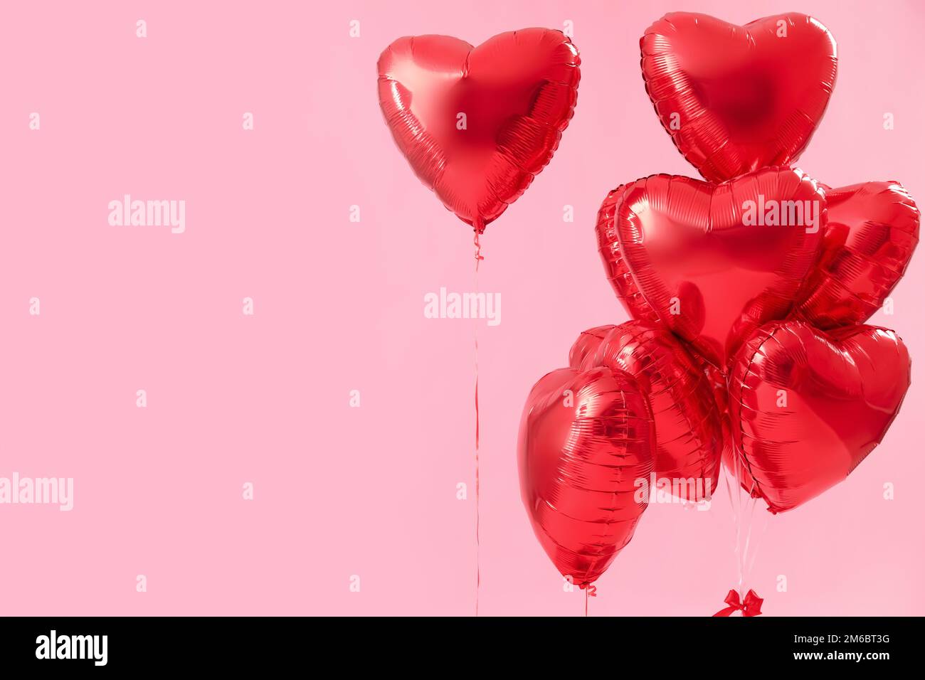 Heart-shaped balloons for Valentine's Day on pink background Stock ...