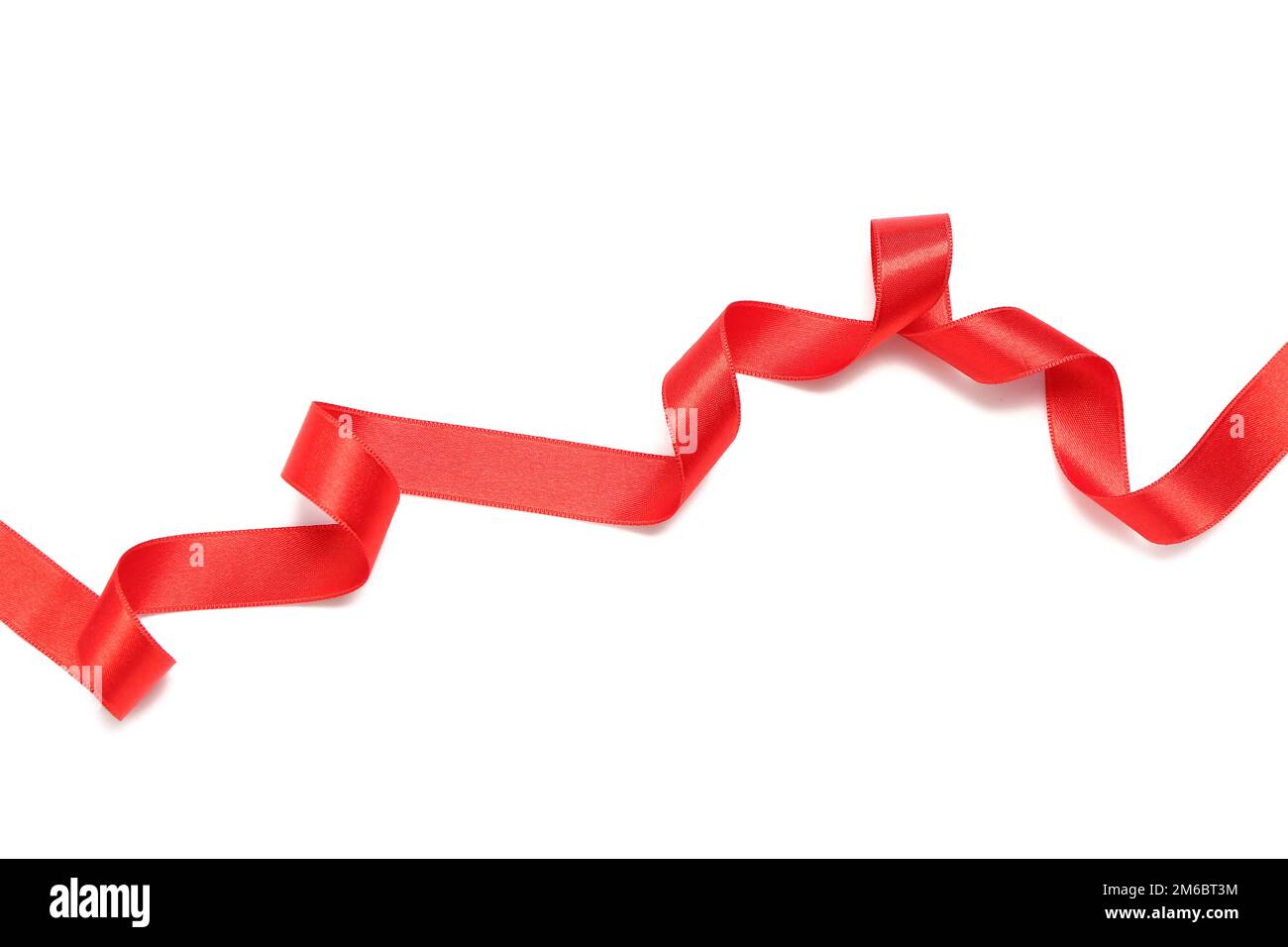 Red curly satin ribbon isolated on white background Stock Photo - Alamy
