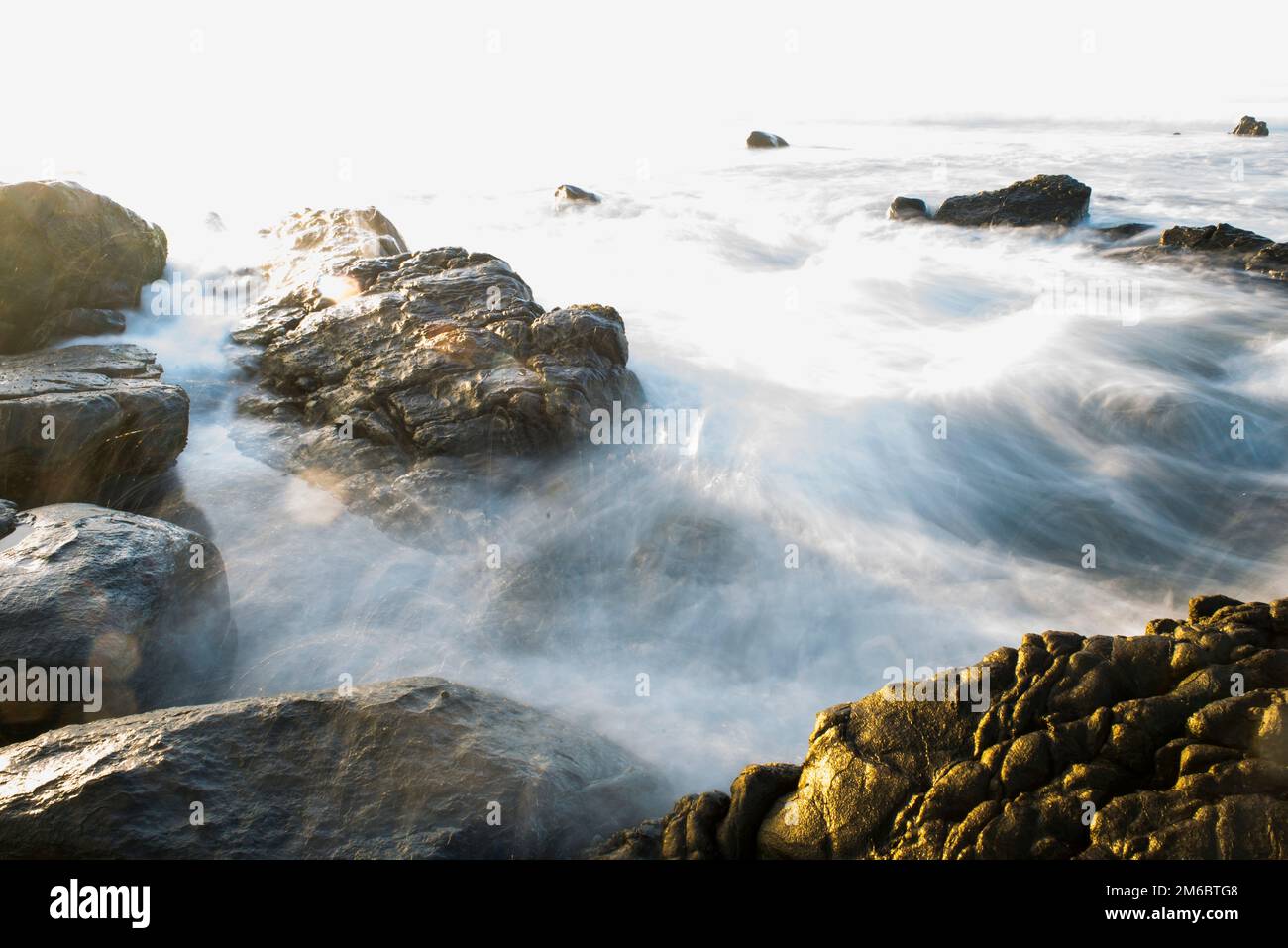 Ocean Tide Flowing Over Rocks Stock Photo - Alamy