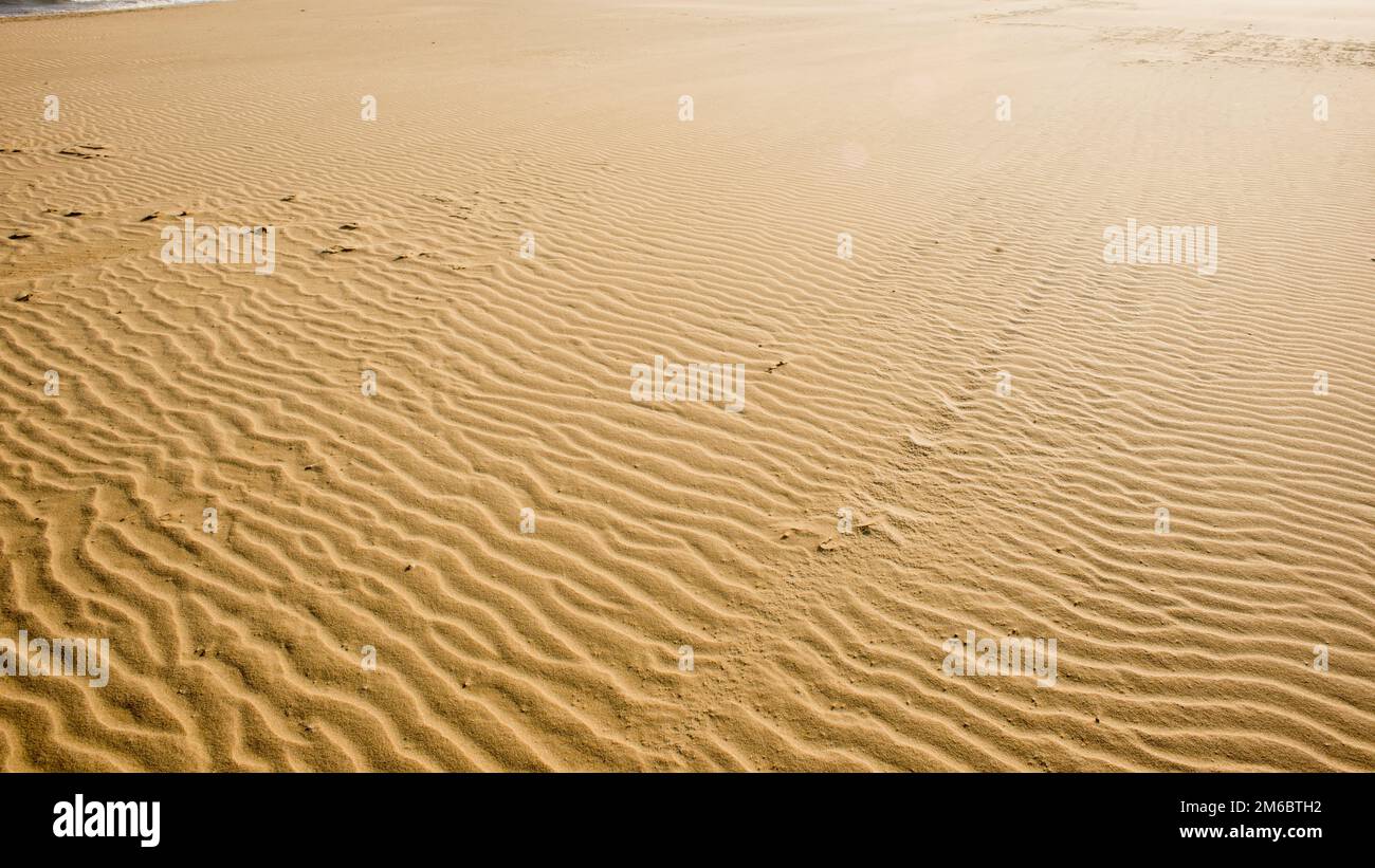 Textured sea sand Stock Photo - Alamy