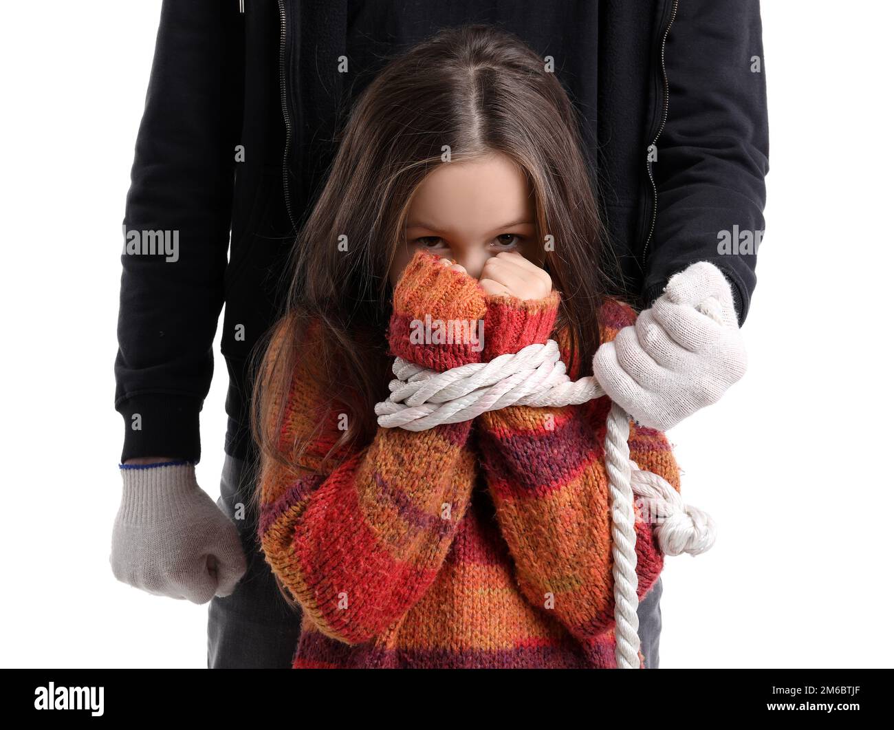 Terrorist and scared little hostage on white background Stock Photo - Alamy