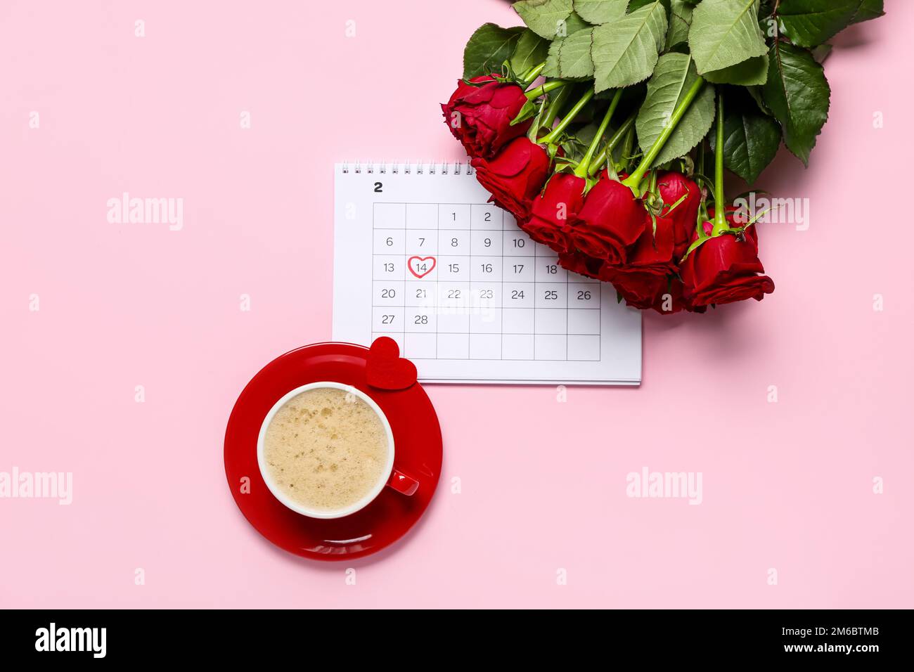 Calendar with marked date of Valentine's Day, roses and cup of latte on ...