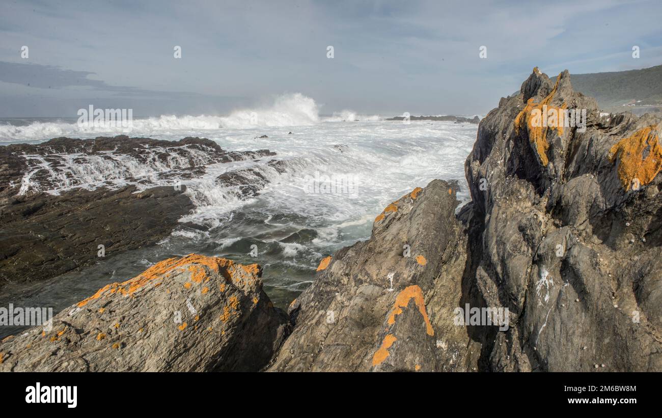 View of Ocean from Behind the Rocks Stock Photo - Alamy