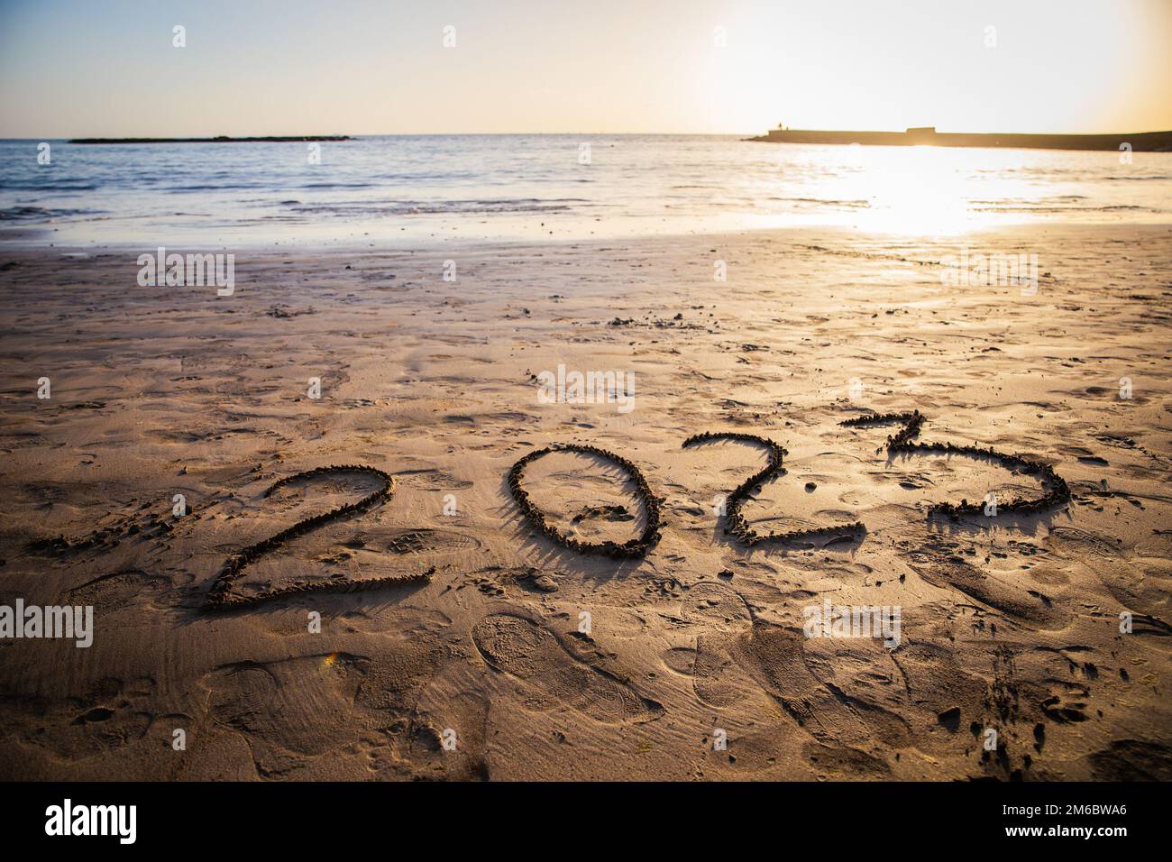 2023 written on the beach during sunset, photo with copy space Stock ...