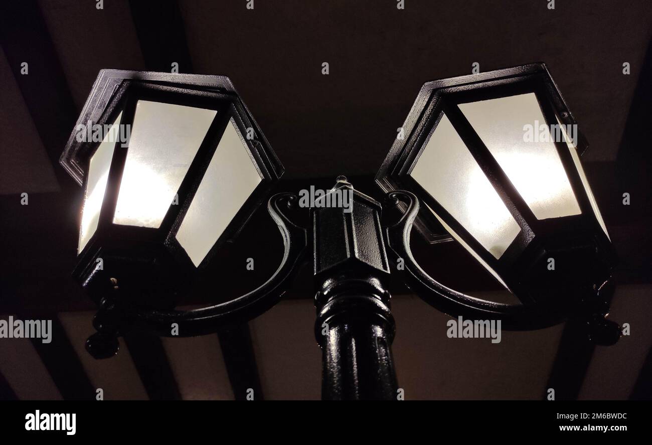 Old street lights in the dark background, vintage lamps, architecture ...