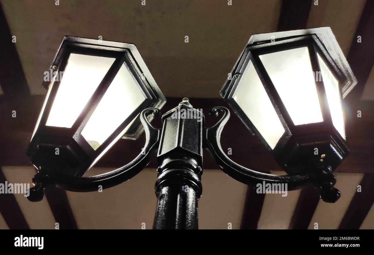 Old street lights in the dark background, vintage lamps, architecture ...